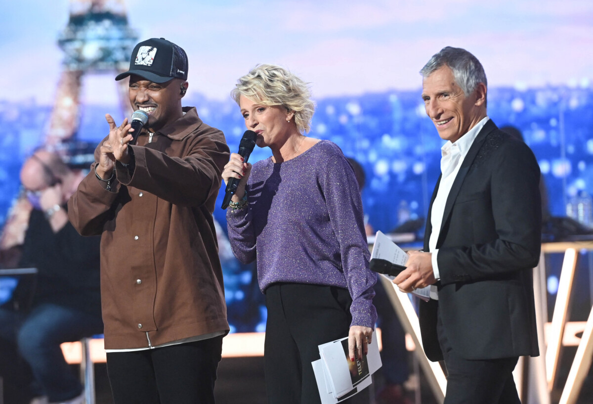 Photo : Soprano, Sophie Davant et Nagui - 36ème Edition du Téléthon à Paris. Le 2 décembre 2022 ...