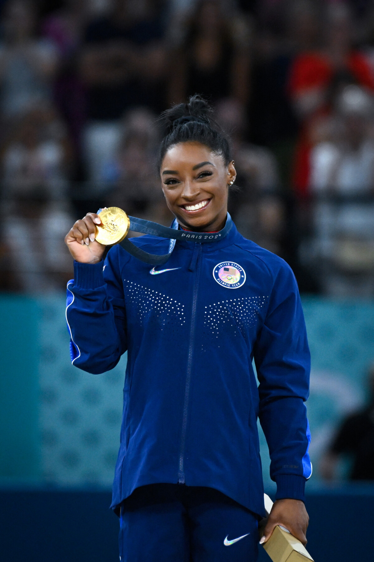 Photo : La gymnaste Simone Biles avec une médaille d'or aux Jeux ...